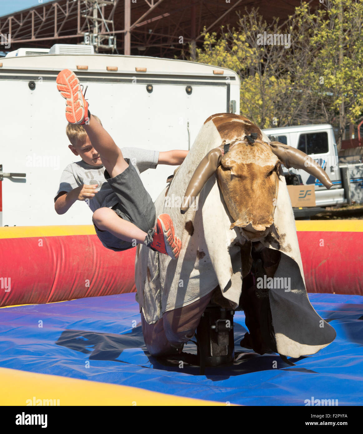 Hutchinson, Kansas 9-13-2015 Young boy shows off his rodeo skills on a ...