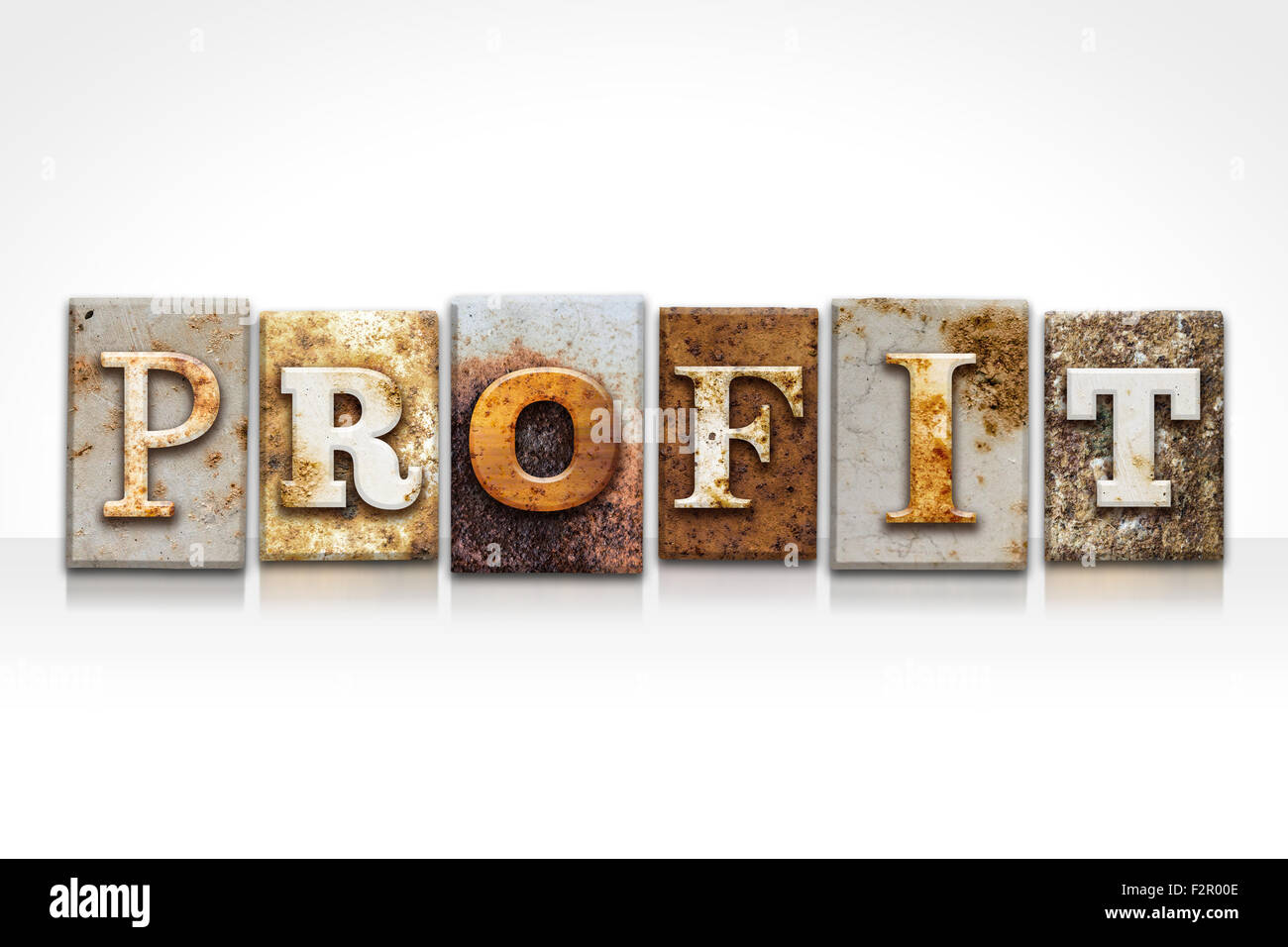 The word "PROFIT" written in rusty metal letterpress type isolated on a ...