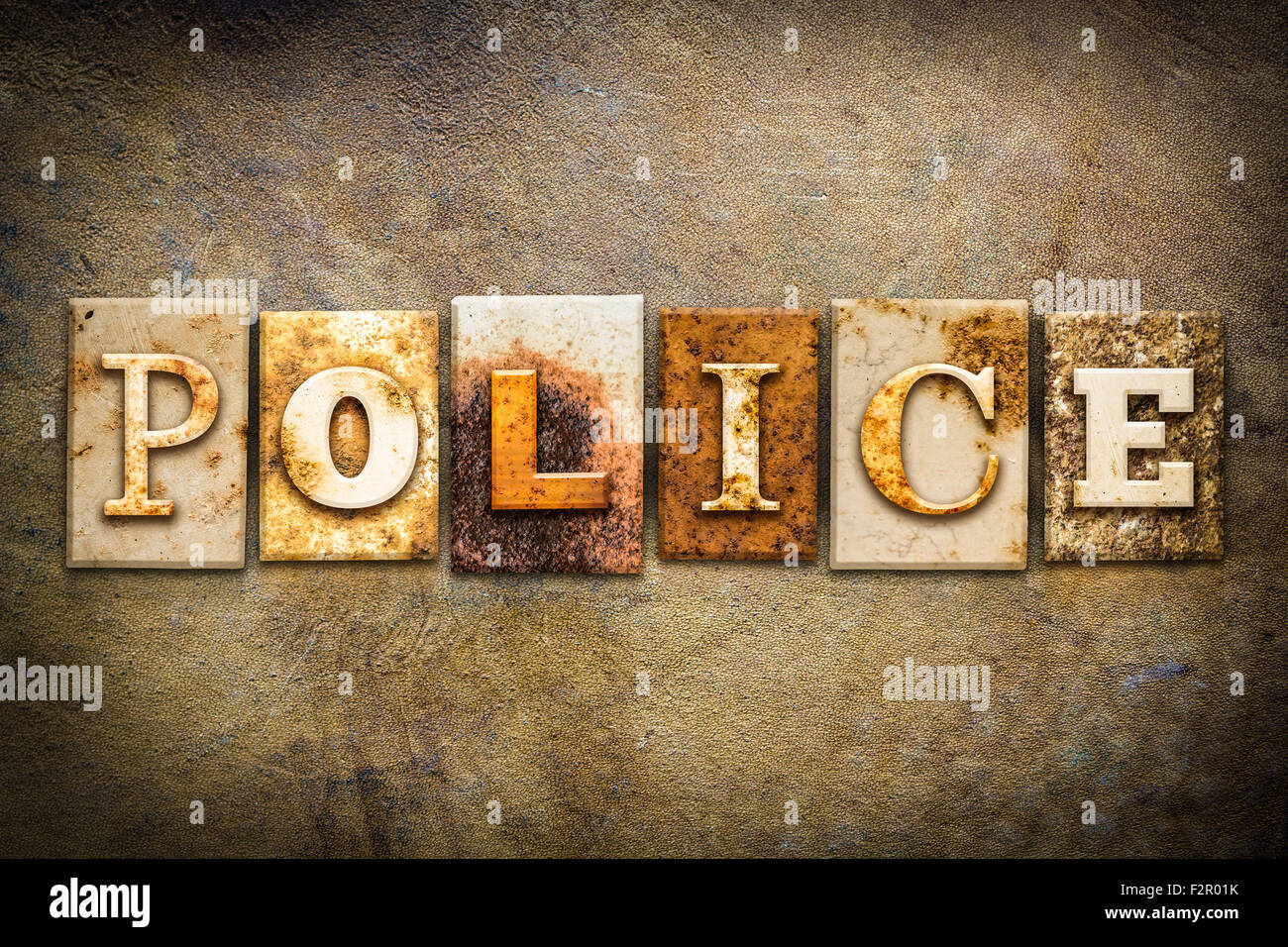 The word "POLICE" written in rusty metal letterpress type on an old ...