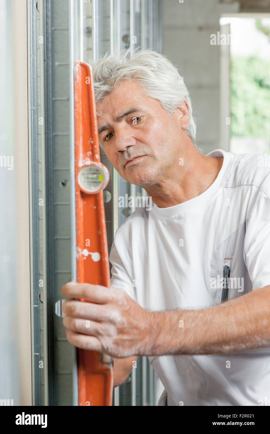 Using a spirit level Stock Photo - Alamy