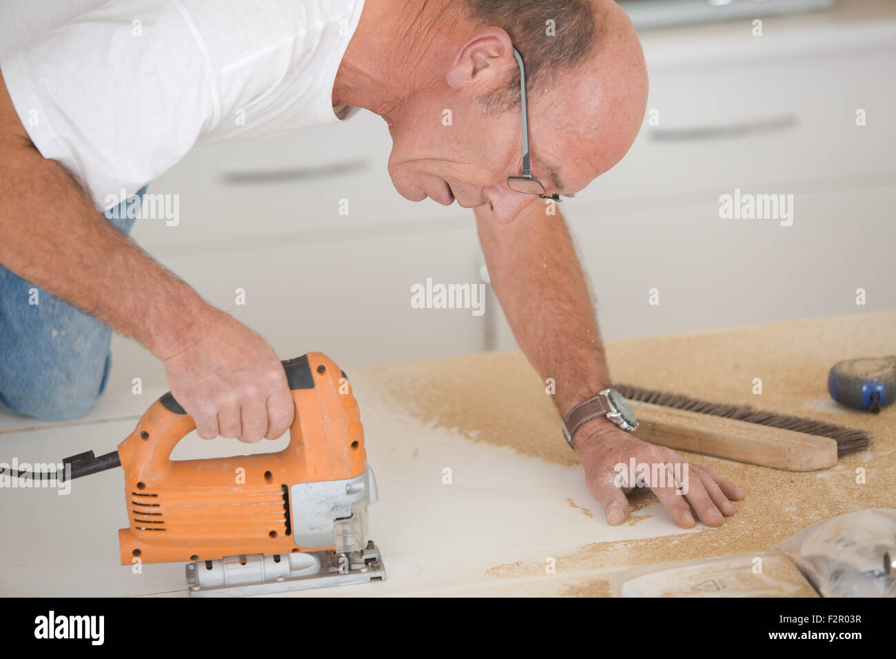 Man using a band saw Stock Photo - Alamy