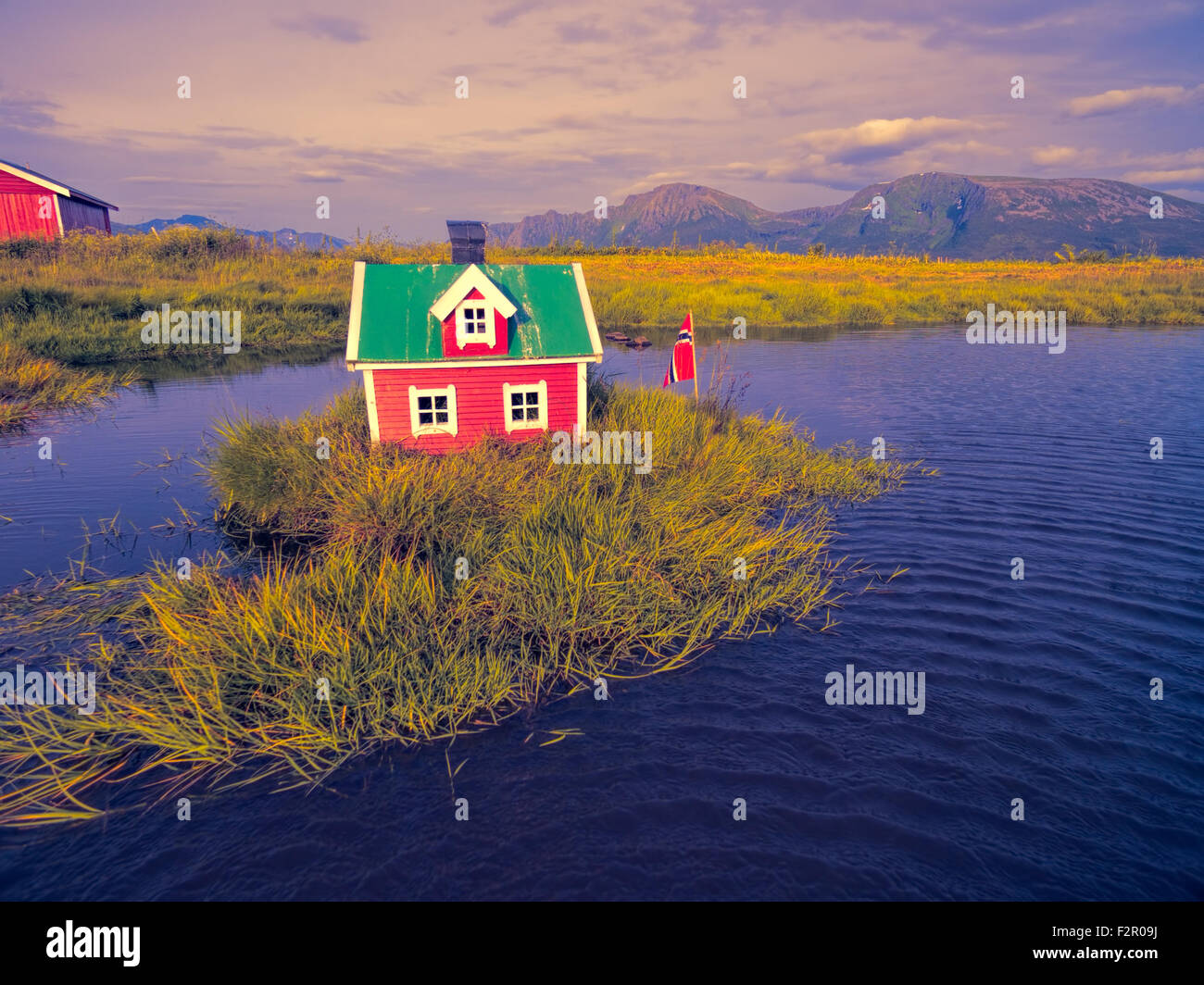 Romantic miniature scandinavian red house on tiny islet Stock Photo - Alamy