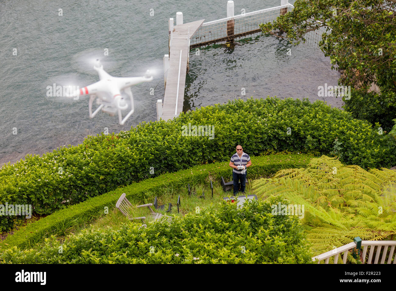 A view from above of a flying drone with a gimbal and camera attached ...