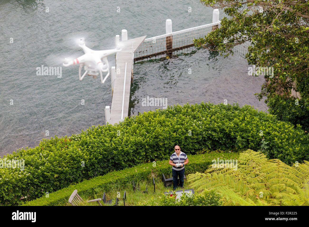 A view from above of a flying drone with a gimbal and camera attached ...