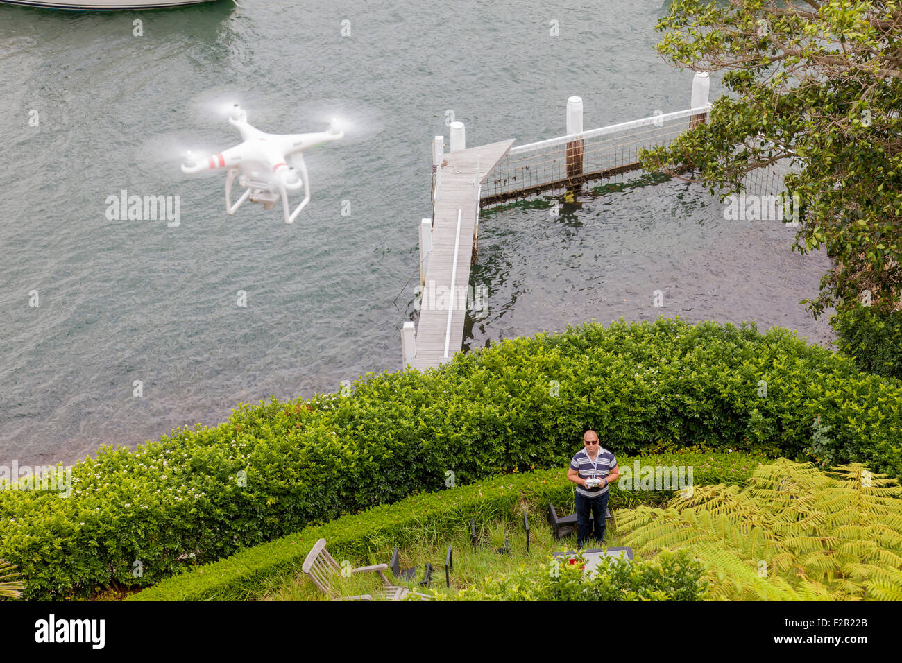 A view from above of a flying drone with a gimbal and camera attached ...