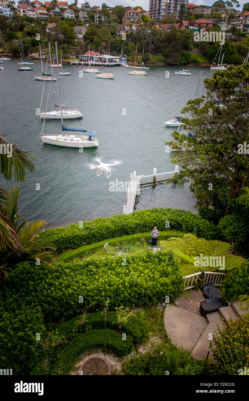 A view from above of a flying drone with a gimbal and camera attached ...