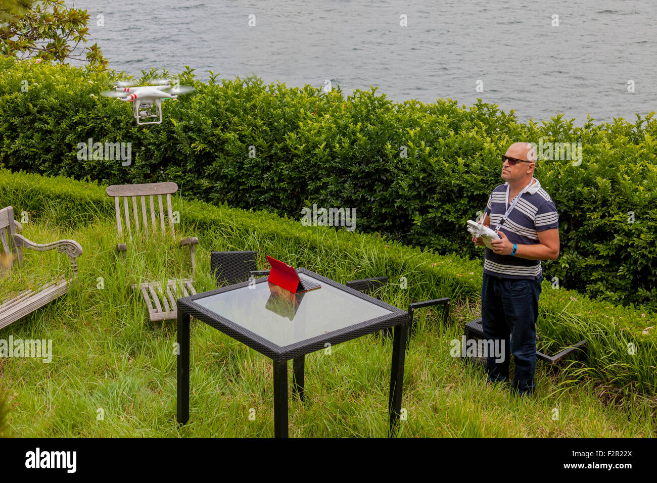 A view from above of a flying drone with a gimbal and camera attached ...