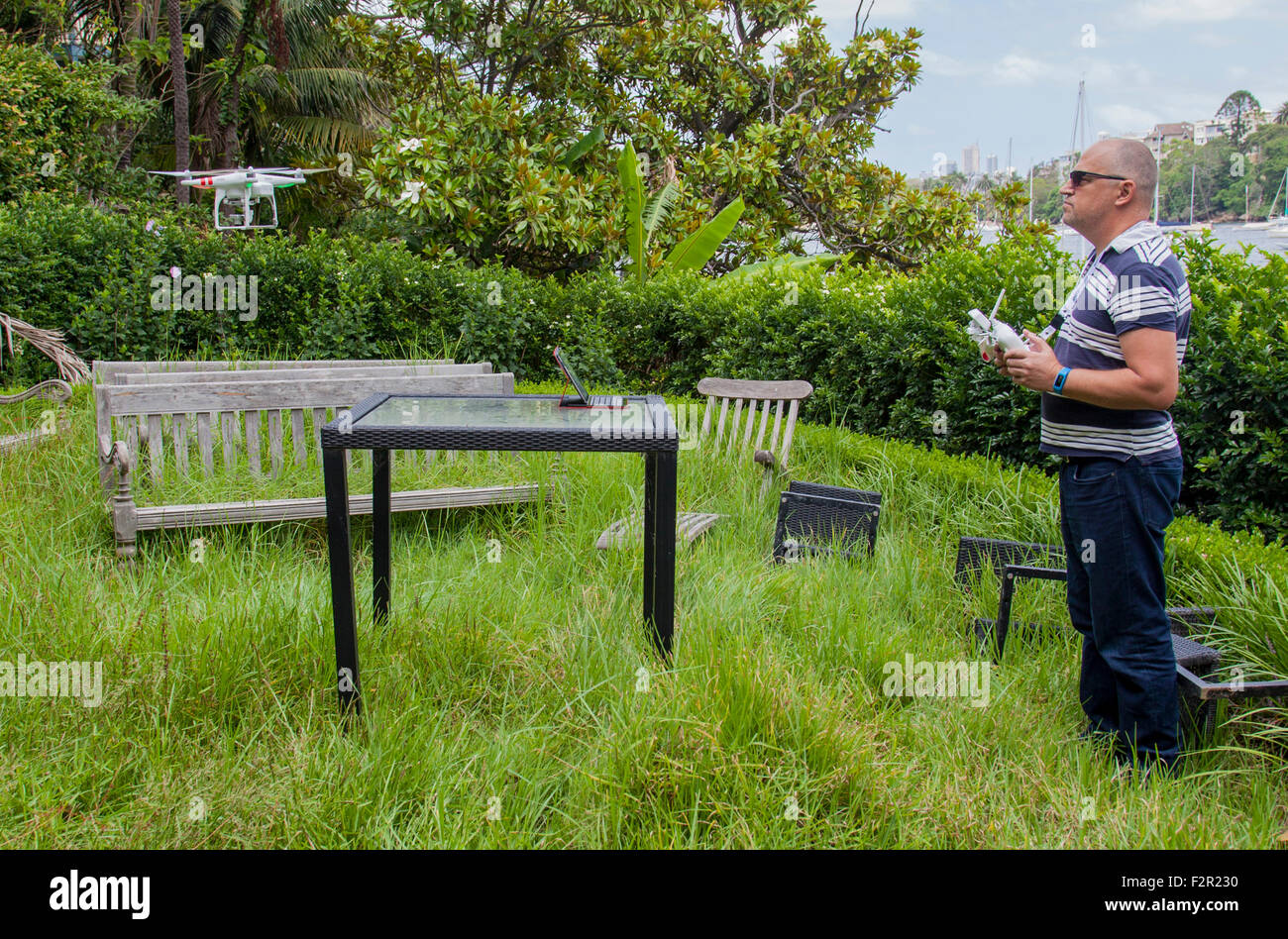 A view from above of a flying drone with a gimbal and camera attached ...