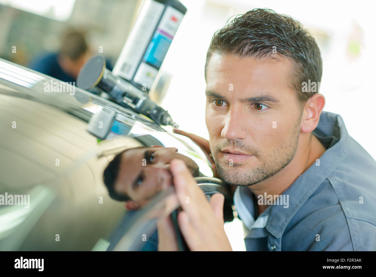 Mechanic working on a car Stock Photo - Alamy