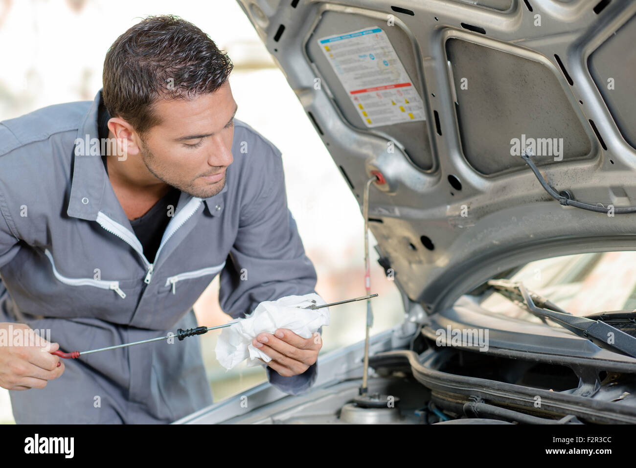 Checking engine's oil level Stock Photo - Alamy