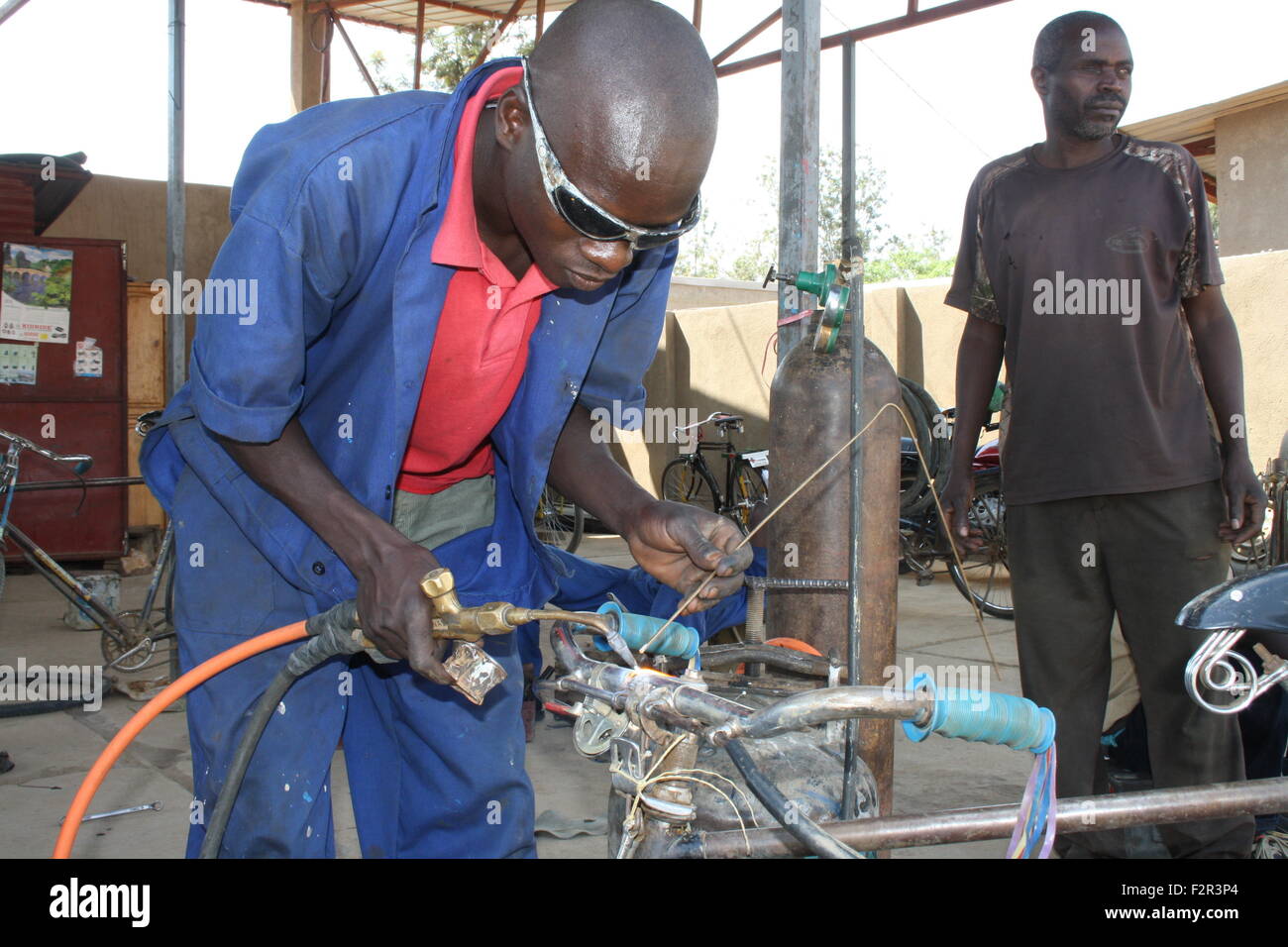 Mayange, Rwanda. 18th Sep, 2015. Bicycle tecnhician, carpenters, metal ...