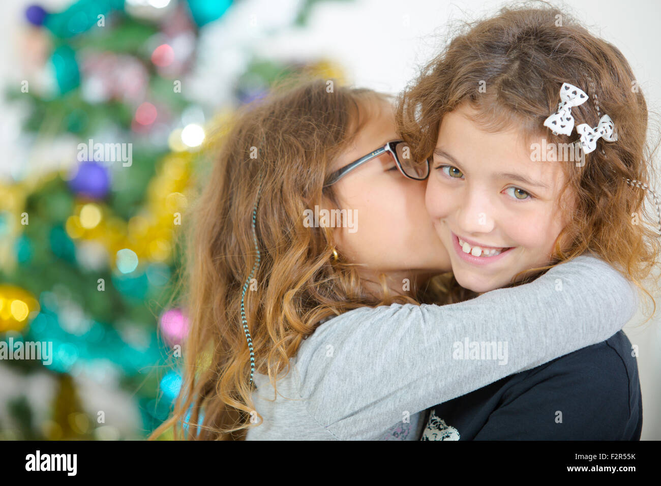 Two young sisters at Christmas Stock Photo - Alamy