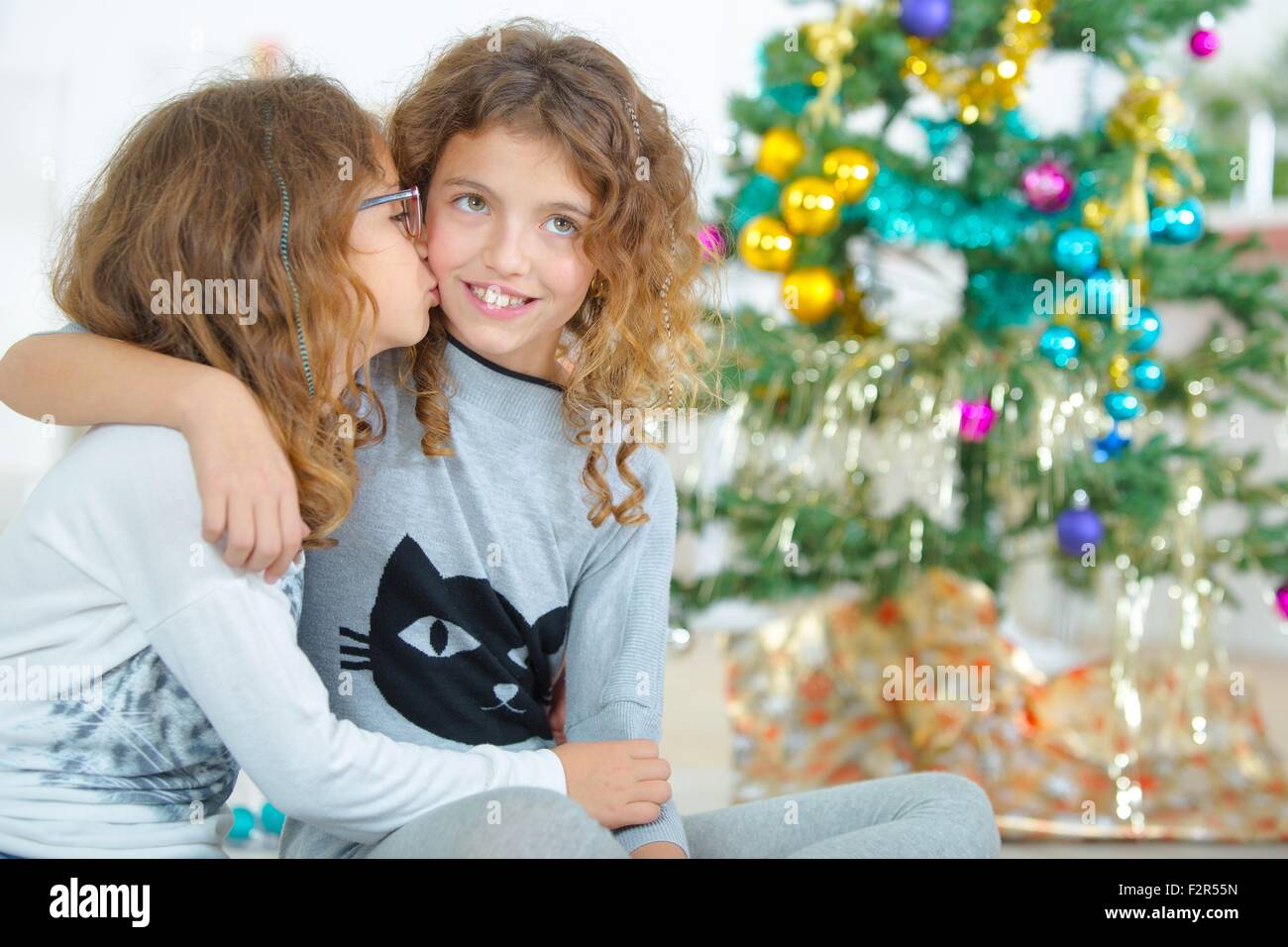 Two sisters excited about Christmas Stock Photo - Alamy