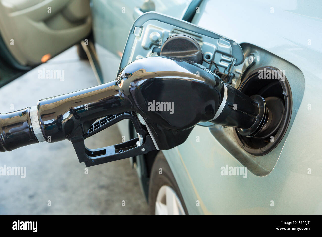 Car at a gas station filling gas Stock Photo - Alamy
