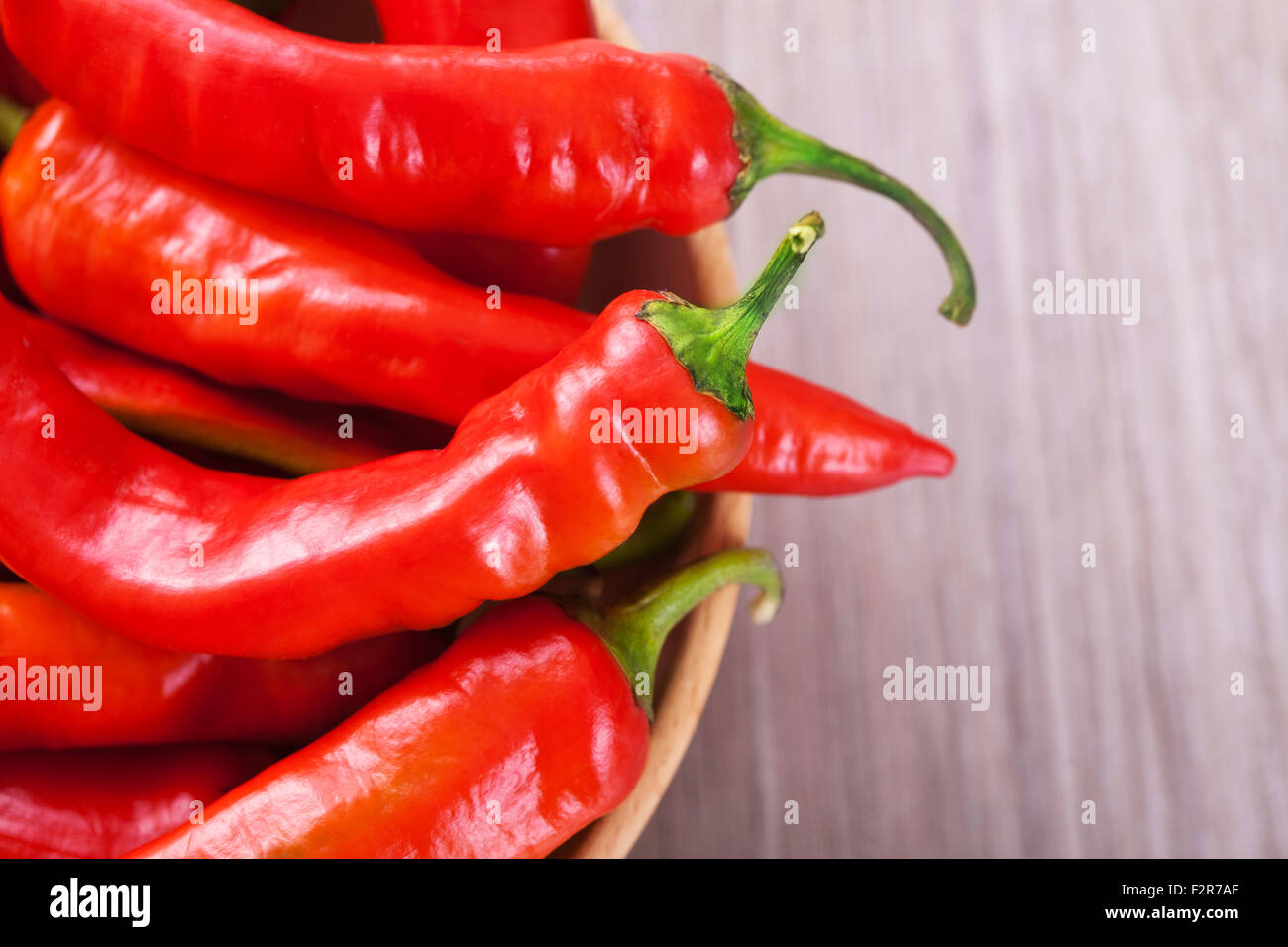 Hot peppers wooden bowl table hi-res stock photography and images - Alamy