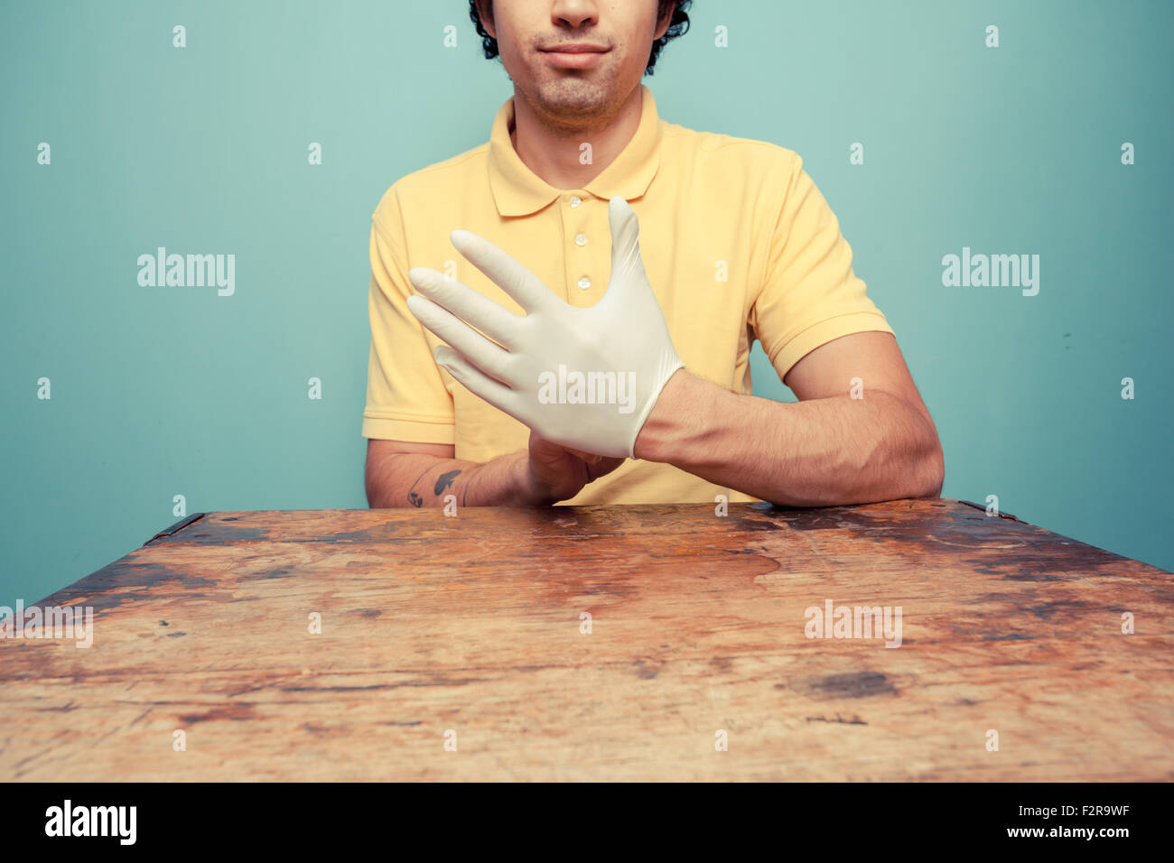 Man putting on wearing medical hi-res stock photography and images - Alamy