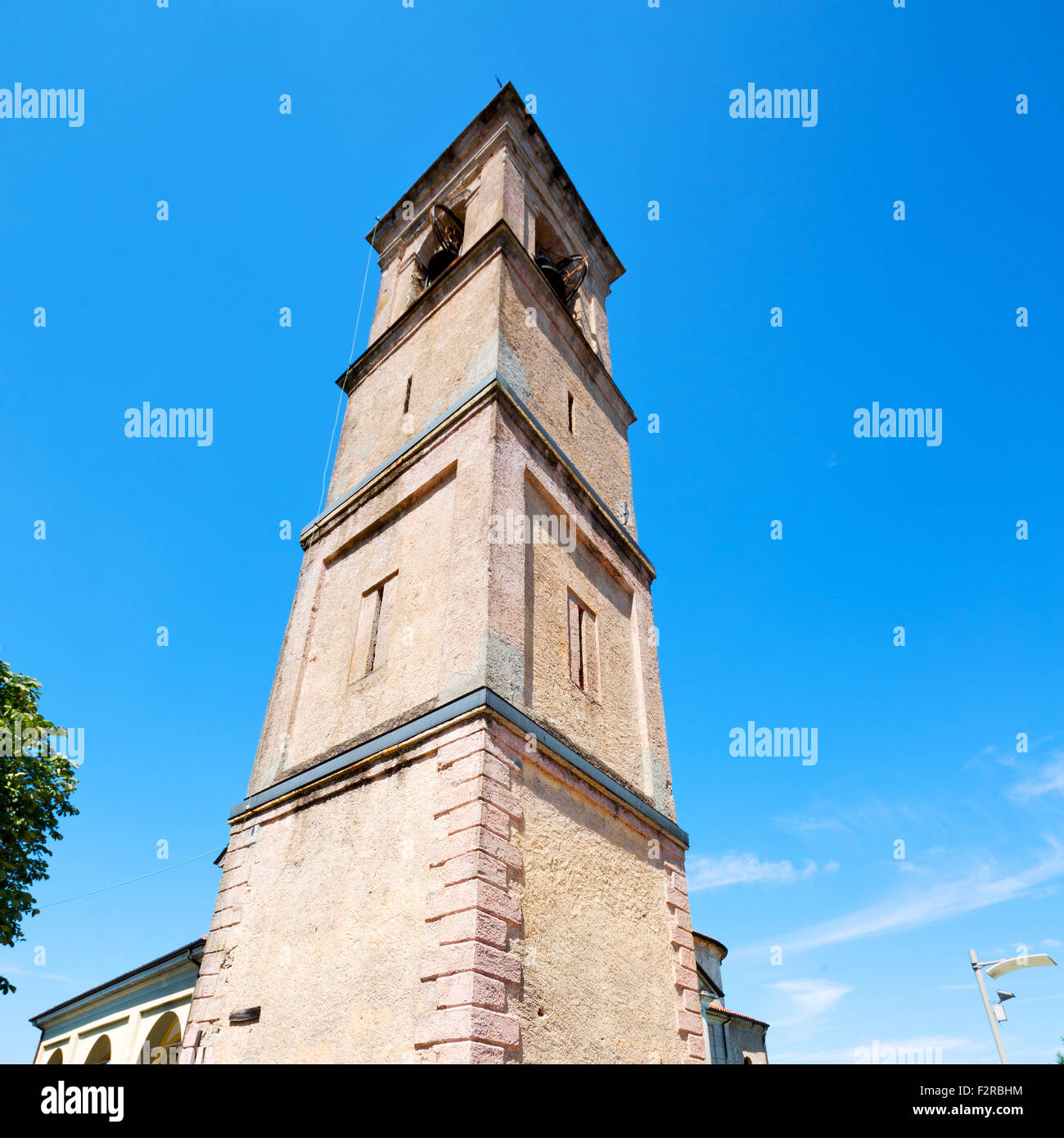 ancien clock tower in italy europe old stone and bell Stock Photo - Alamy