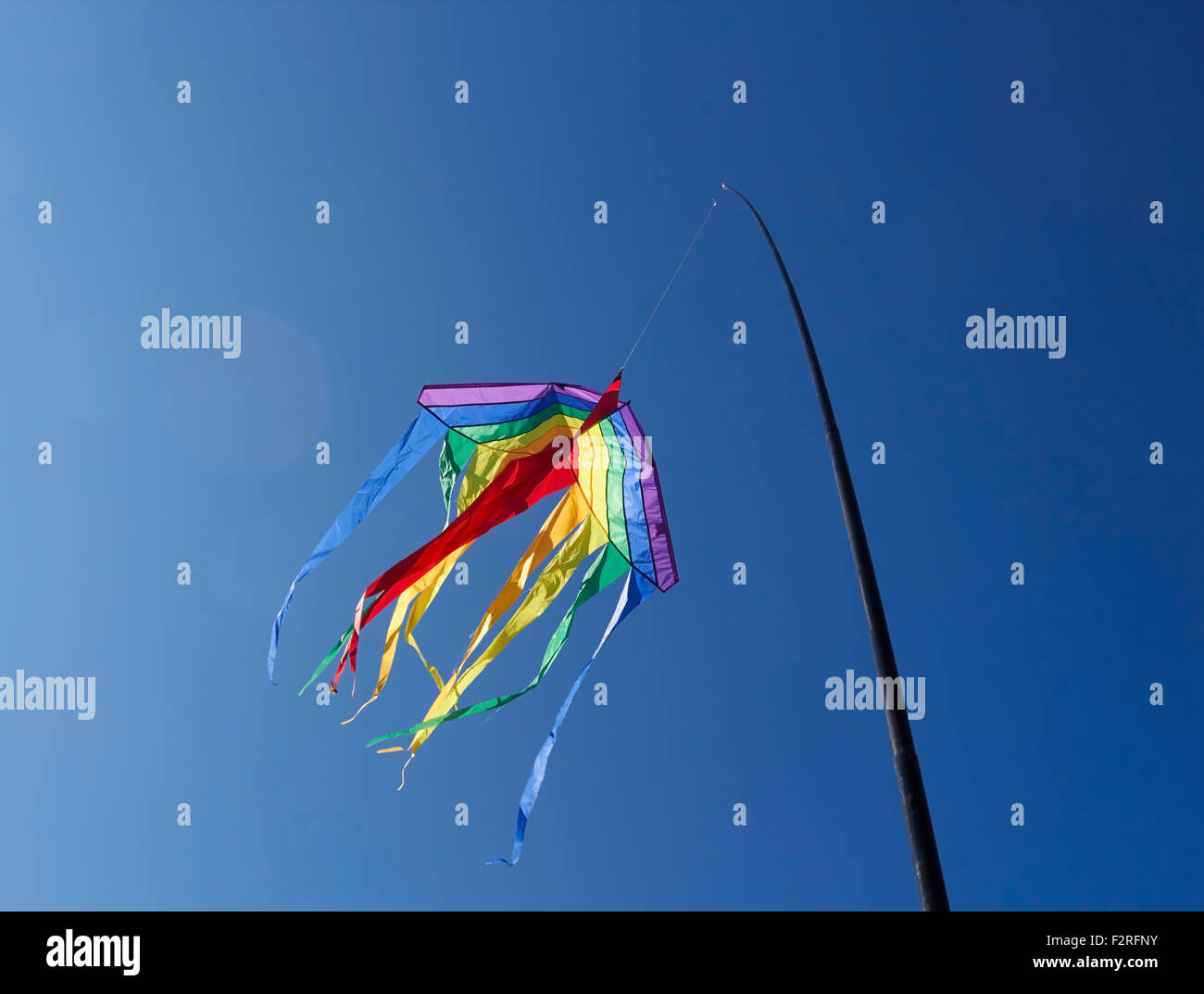 colourful kite against blue sky Stock Photo - Alamy