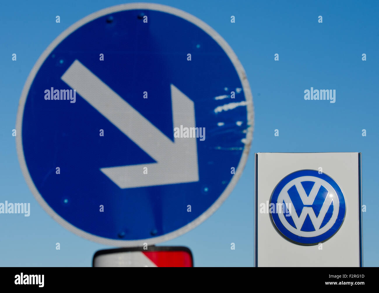 A traffic sign seemingly 'pointing' to a corporate logo of German car ...
