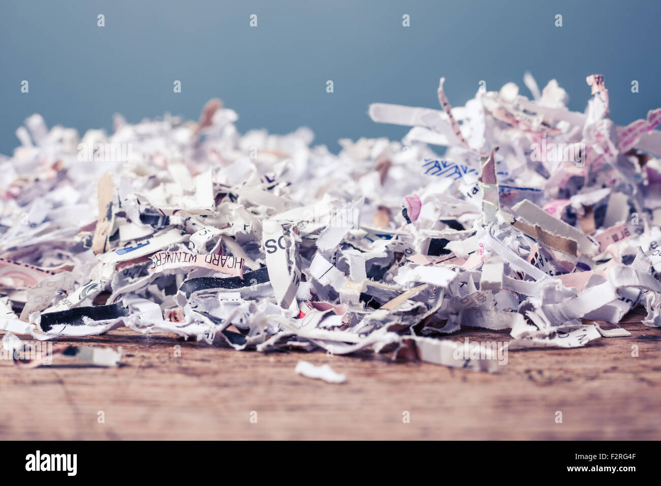 Paper cut into tiny pieces by cross shredder Stock Photo - Alamy