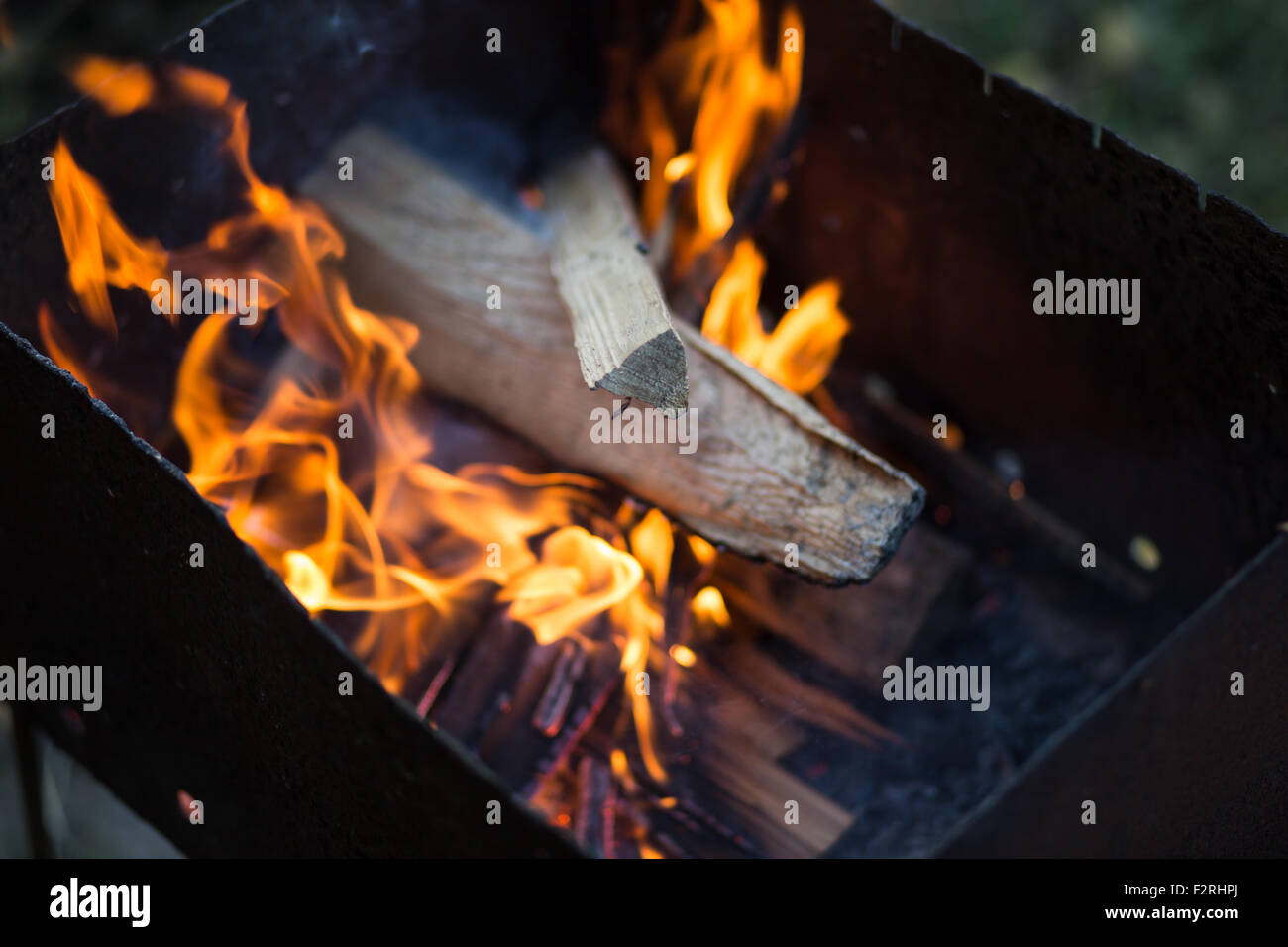 Fire in barbeque grill set. Burning wood Stock Photo - Alamy