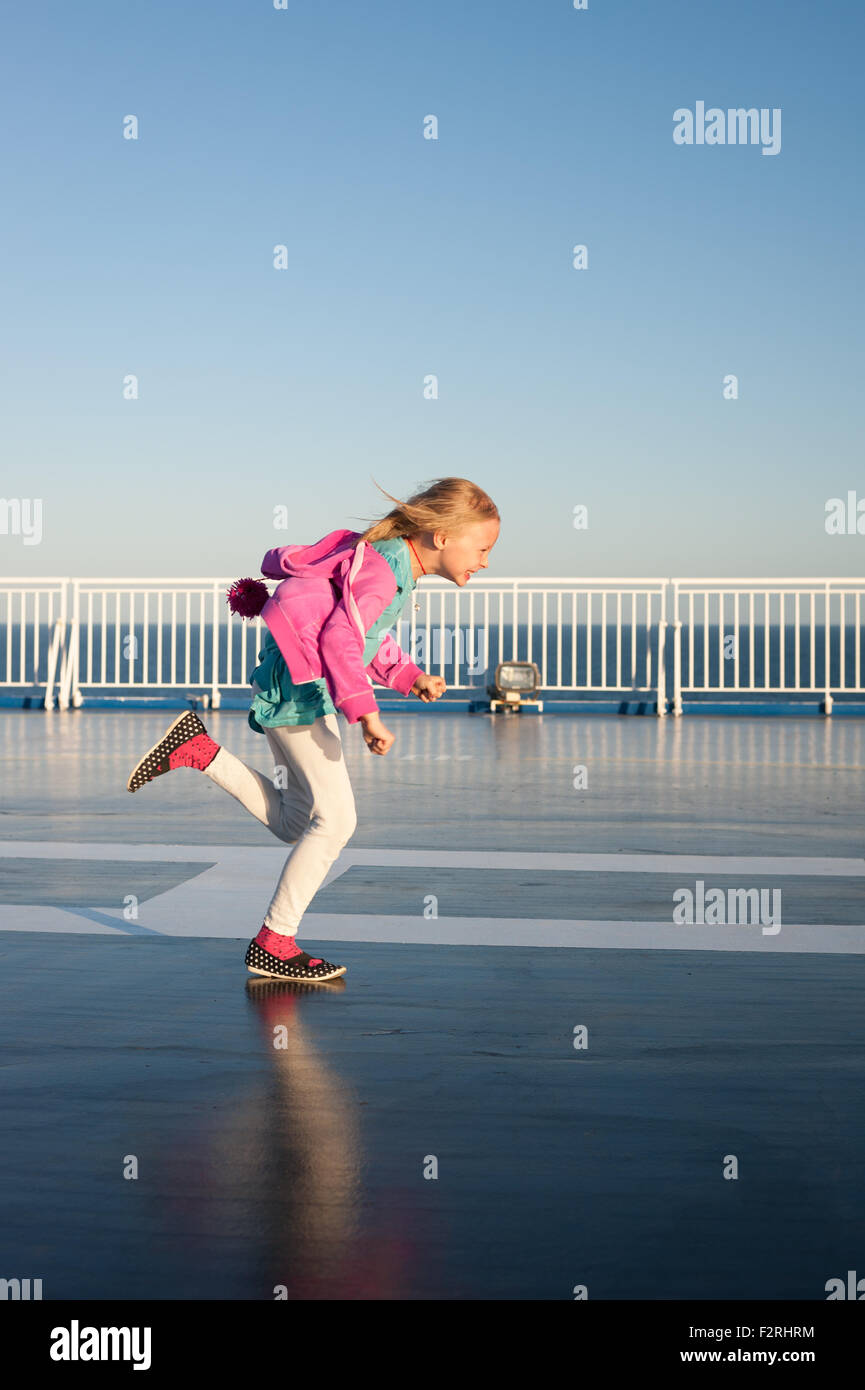 Kids running around on ferry deck Stock Photo - Alamy