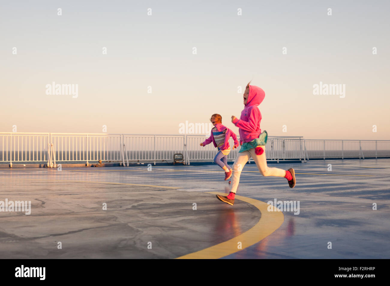 Kids running around on ferry deck Stock Photo - Alamy
