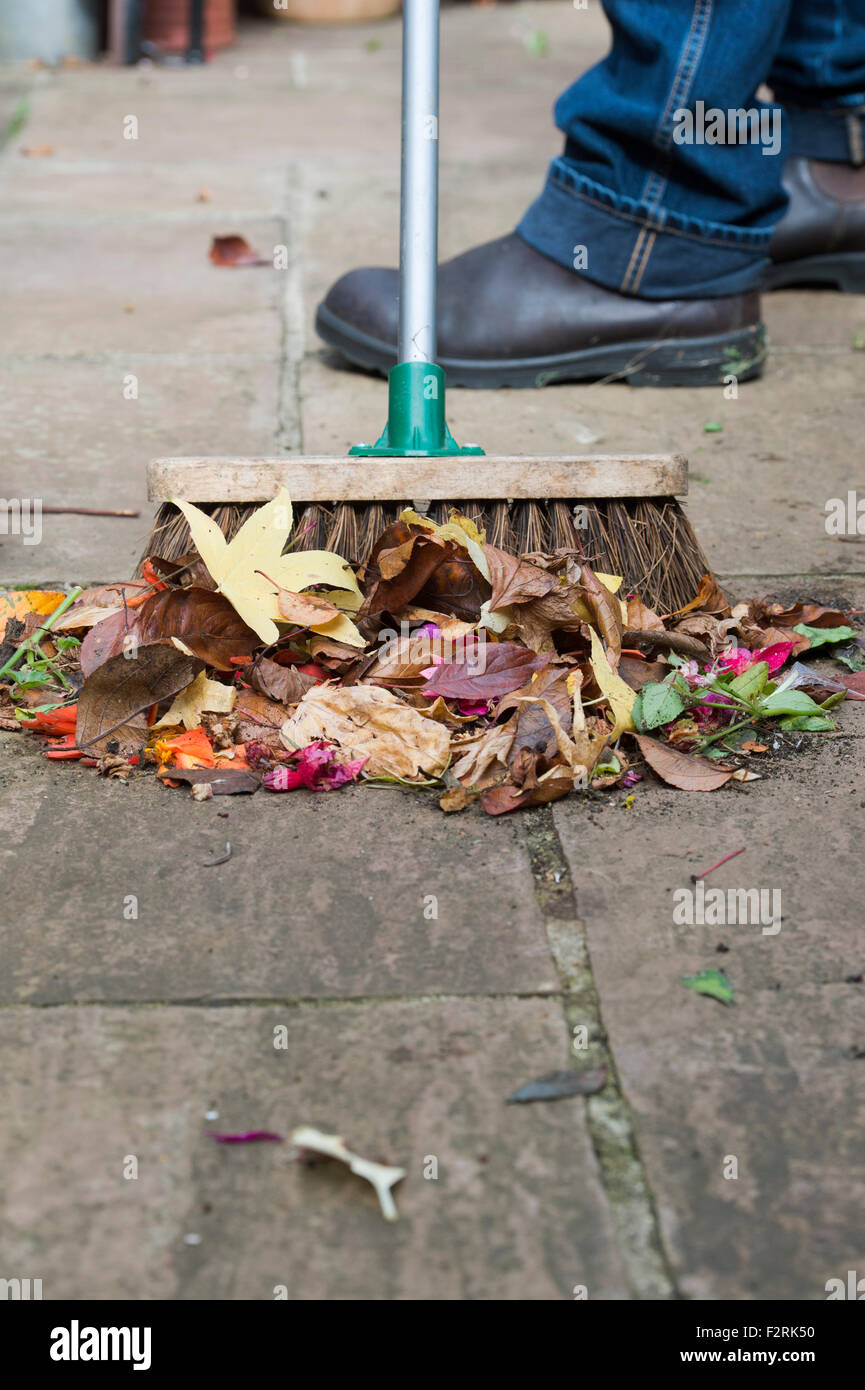 Sweeping autumn leaves hi-res stock photography and images - Alamy