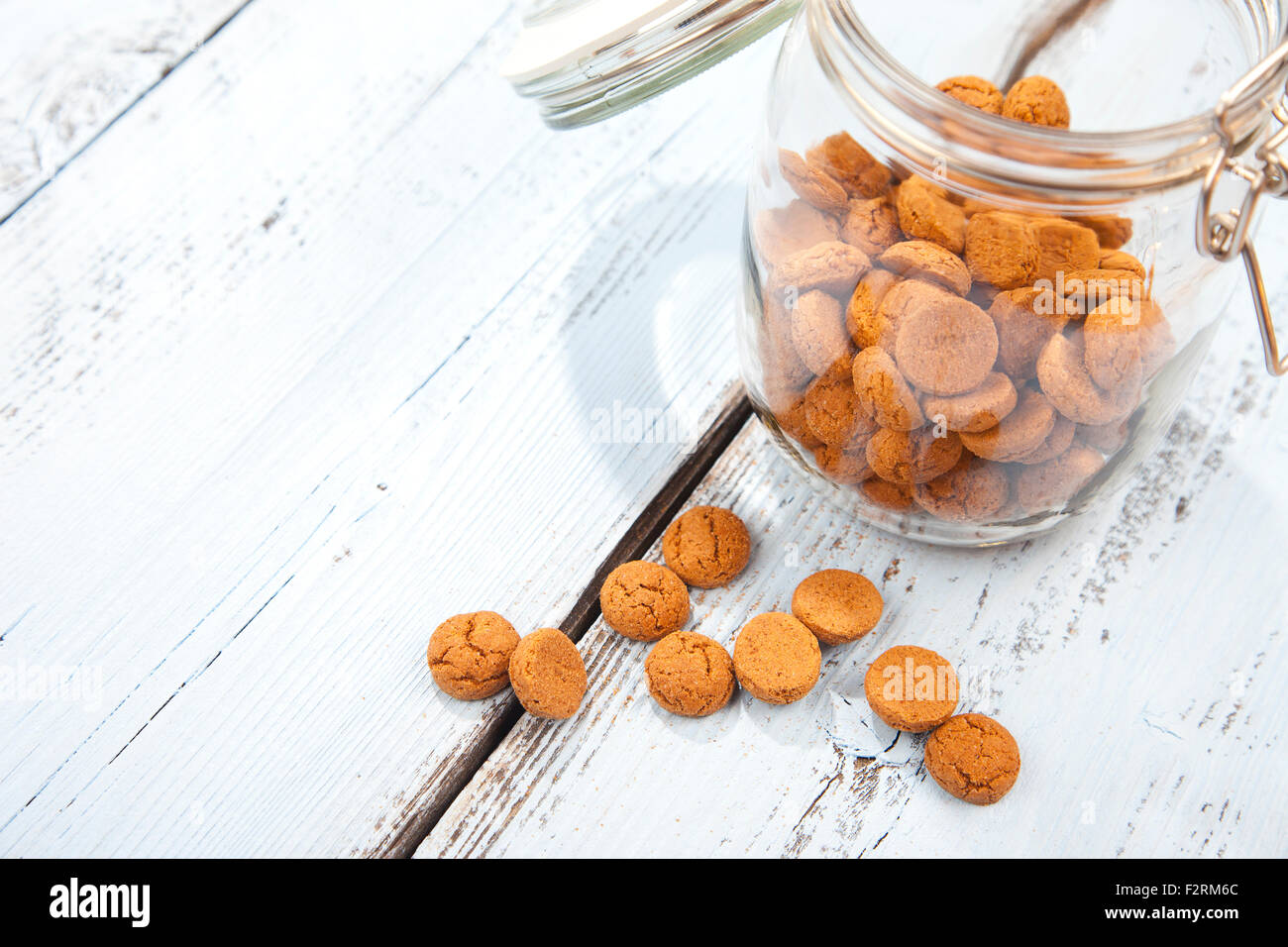 Dutch candy pepernoot with glass jar and white wooden background Stock ...
