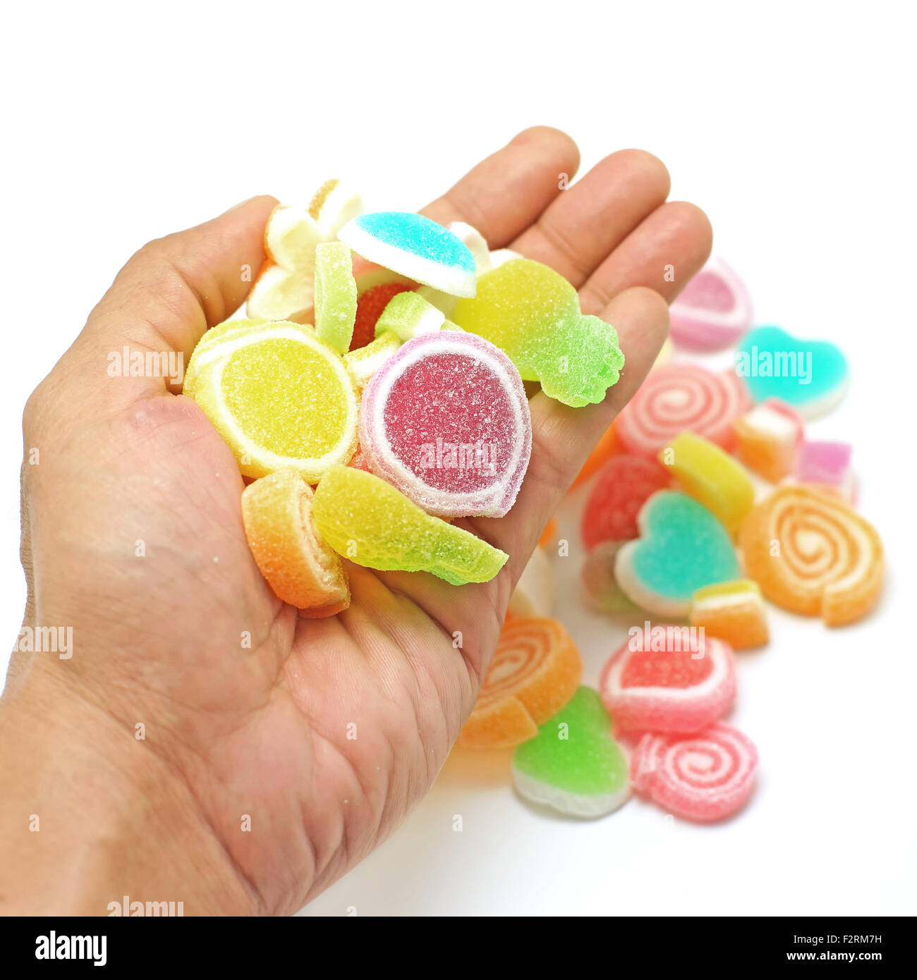 human hand pick up jelly sweet candy isolated on white background Stock ...