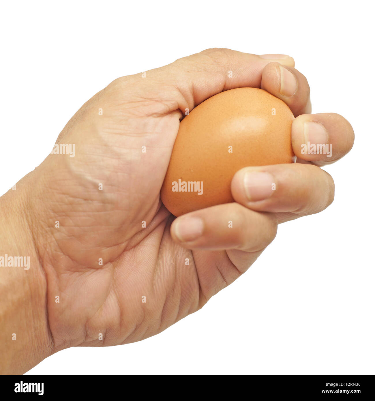 egg in male hand isolated on white background Stock Photo - Alamy