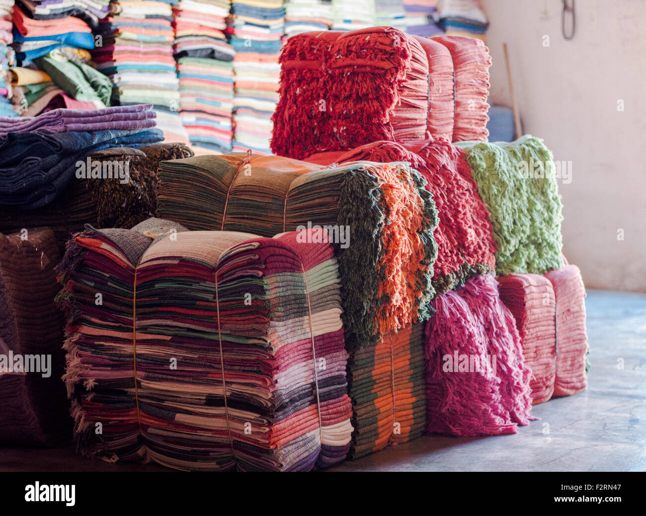 Colorful blankets in bundles waiting to be shipped out Stock Photo - Alamy