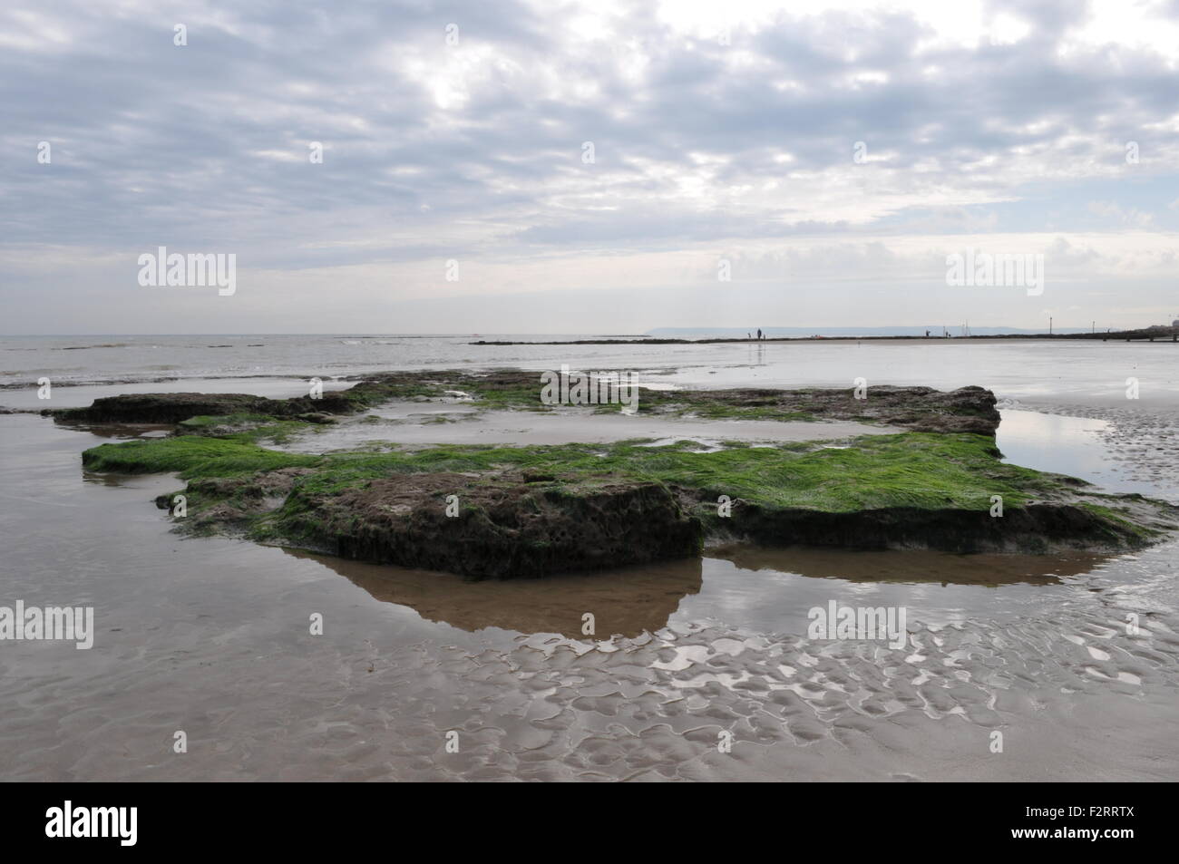 Seascape with wild rock formation and dramatic sky Stock Photo - Alamy
