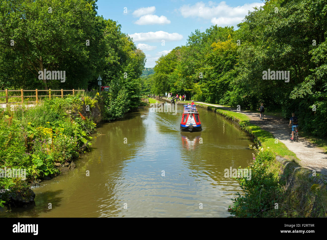 A narrowboat between 2 of the 16 locks on the Peak Forest Canal at ...