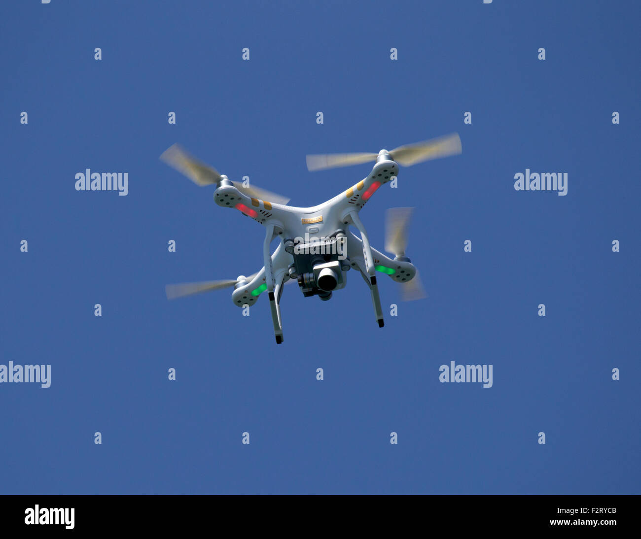 Drone with Camera Hovering in Air Stock Photo - Alamy