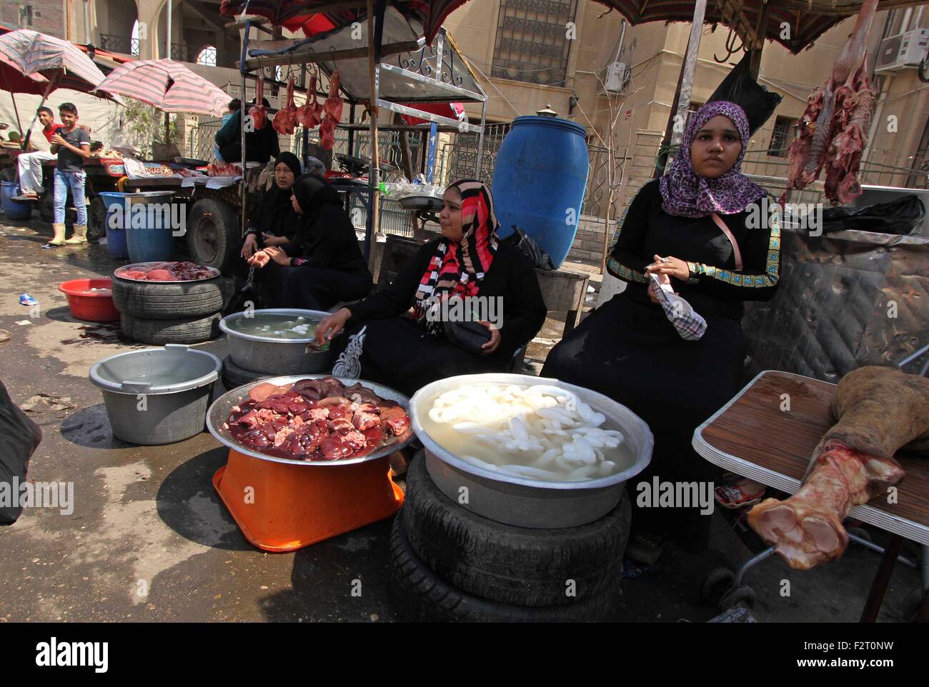Cairo, Egypt. 21st Sep, 2015. Egyptian women sell buffalo meat at a ...