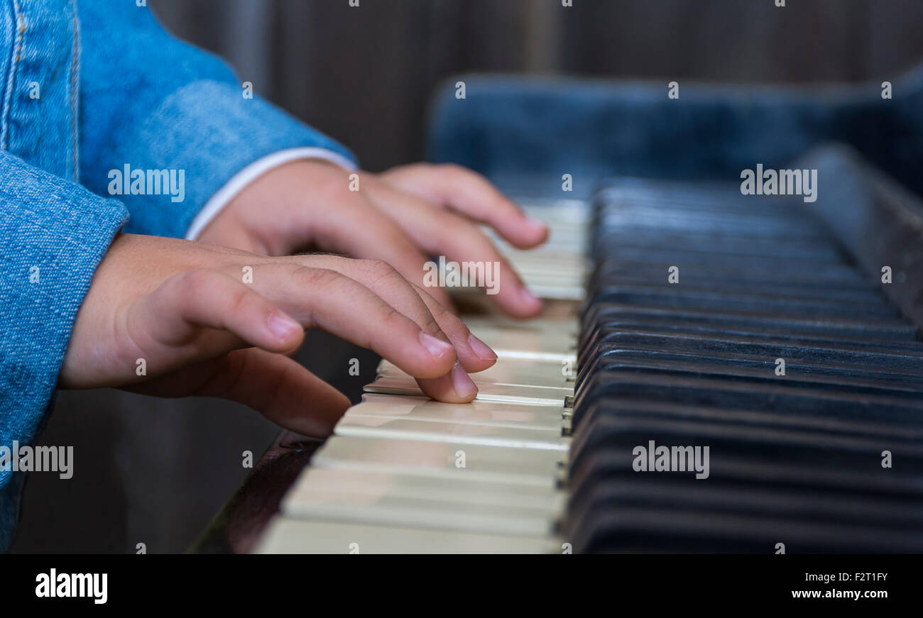 Child playing piano hi-res stock photography and images - Alamy