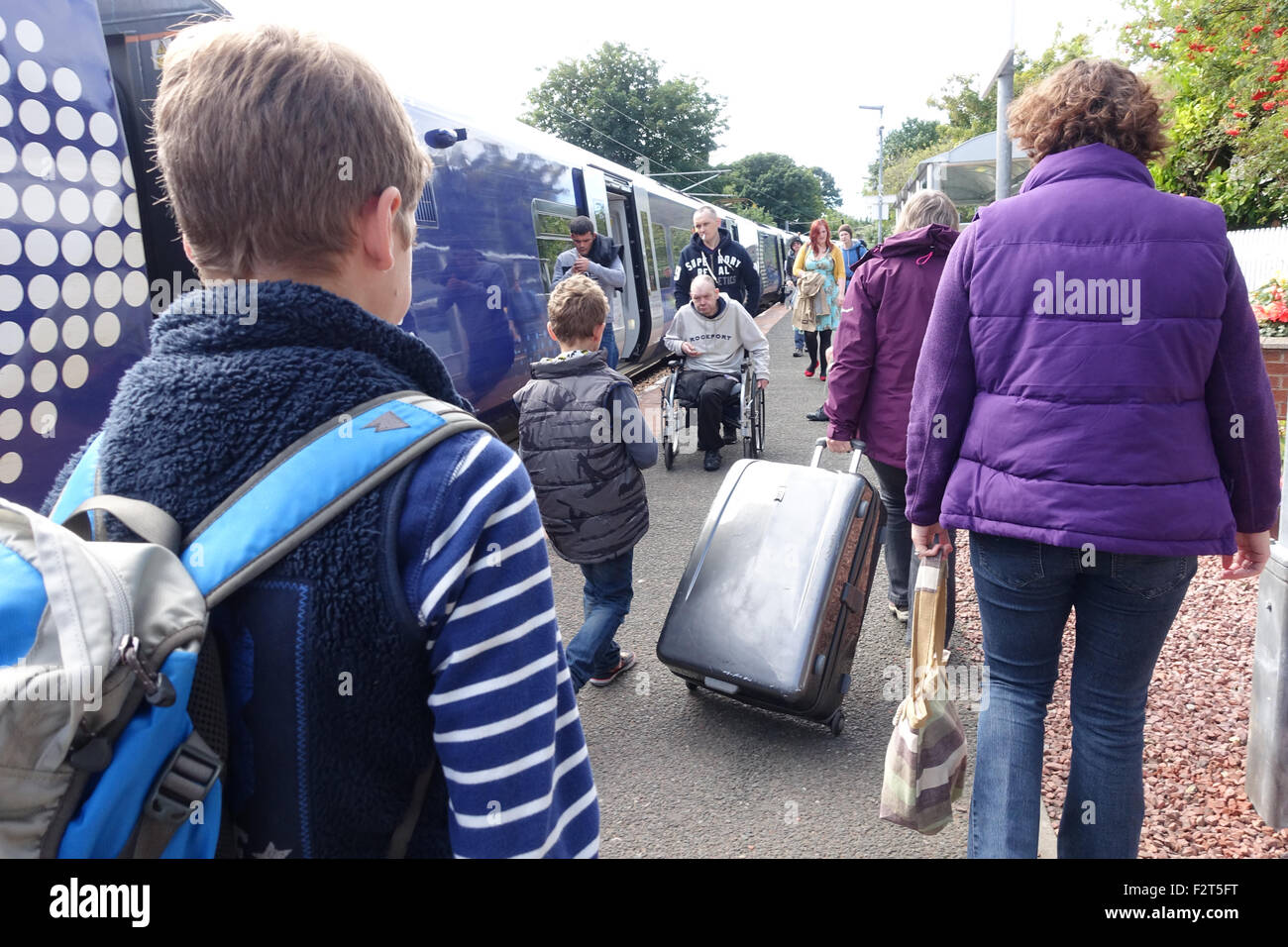 Passengers at Railway Station Stock Photo - Alamy