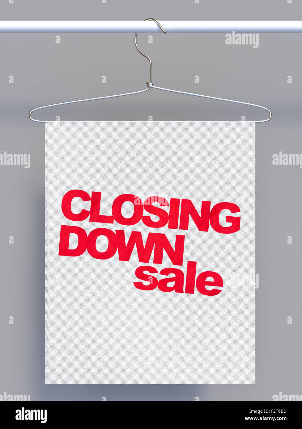Wire hanger on clothes rail and banner with sale sign Stock Photo - Alamy