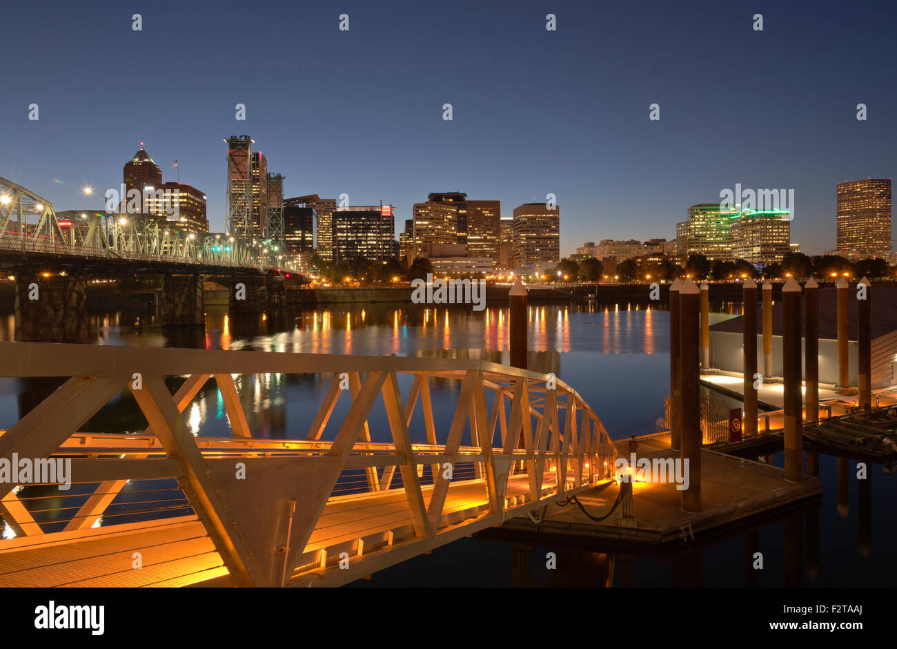 City of Portland Oregon skyline river and pedestrian bridge at twilight ...
