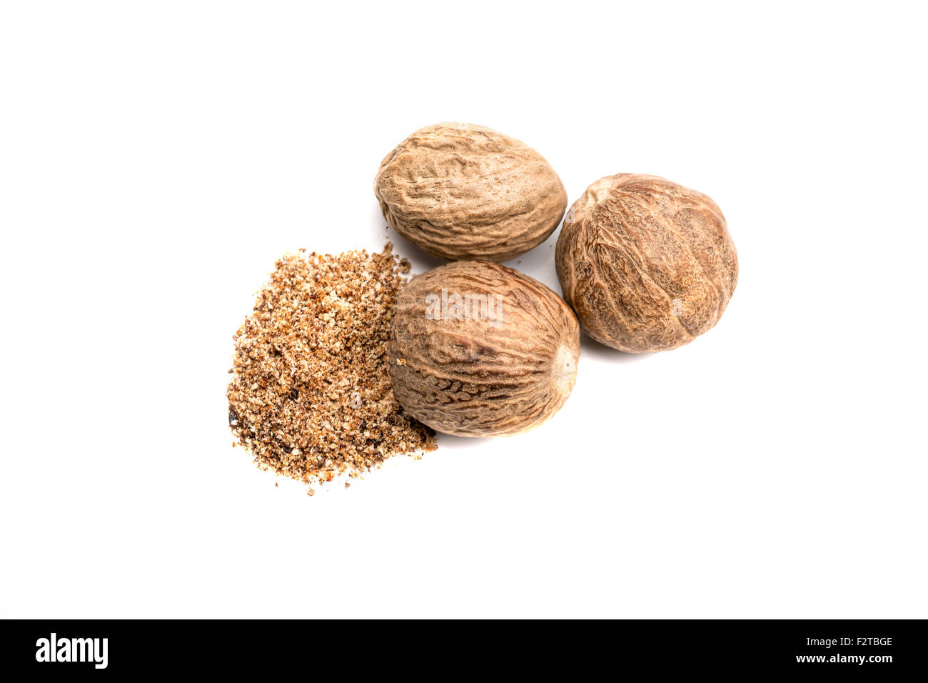 nutmeg and nutmeg powder on white background Stock Photo - Alamy