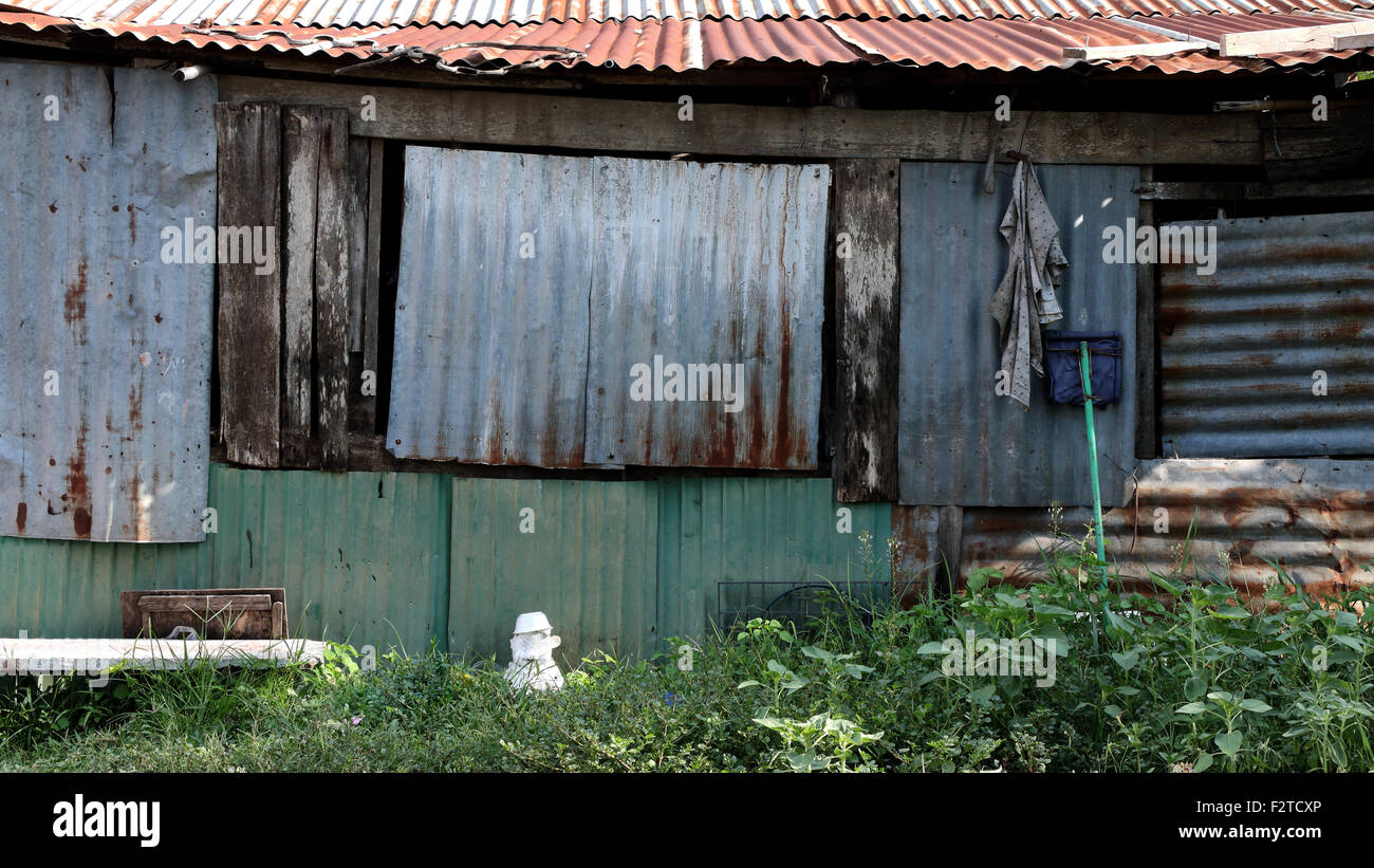the rusted metal exterior of an old building in slum Stock Photo - Alamy