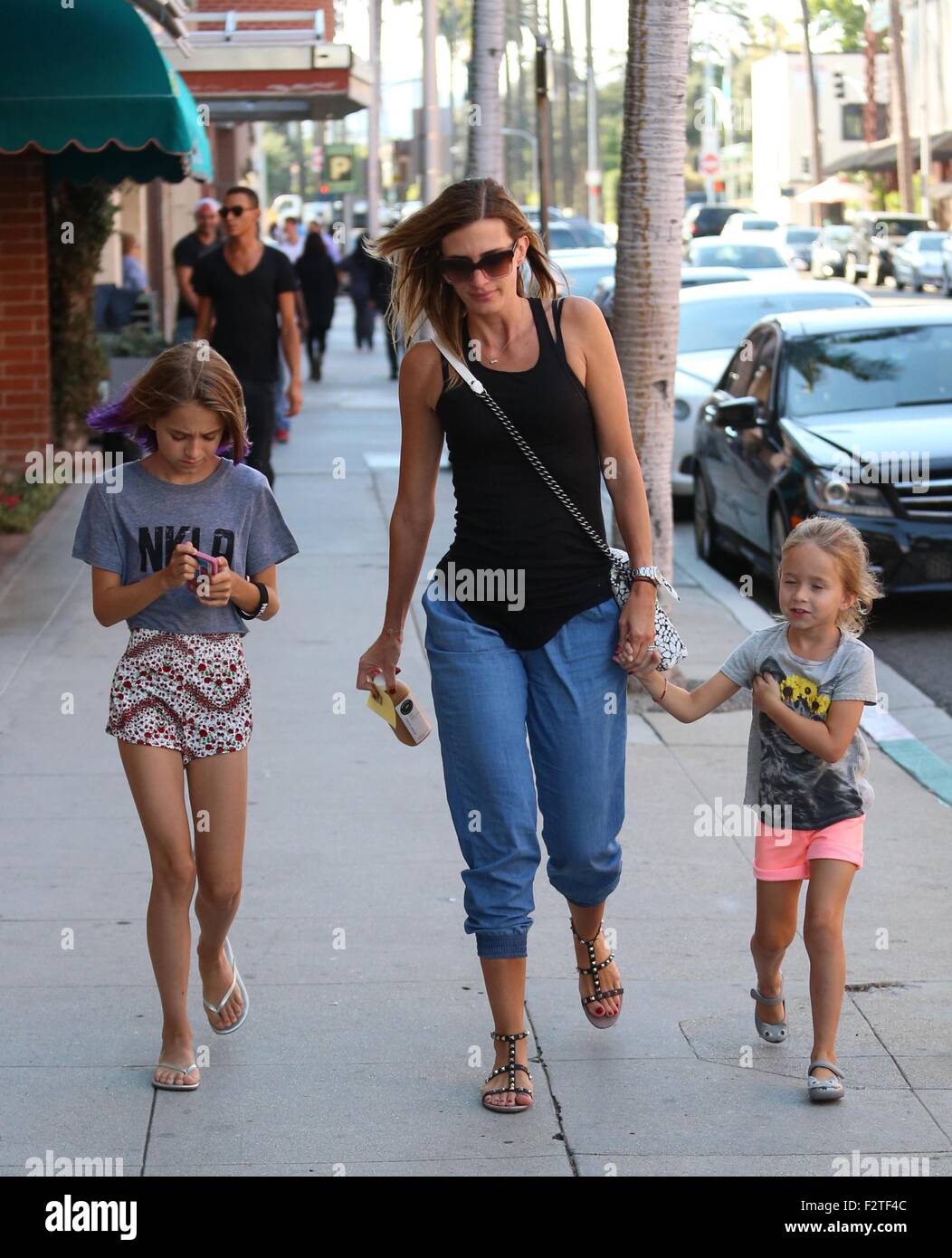 Rhea Durham and her daughters pick up juice from Pressed Juicery in ...