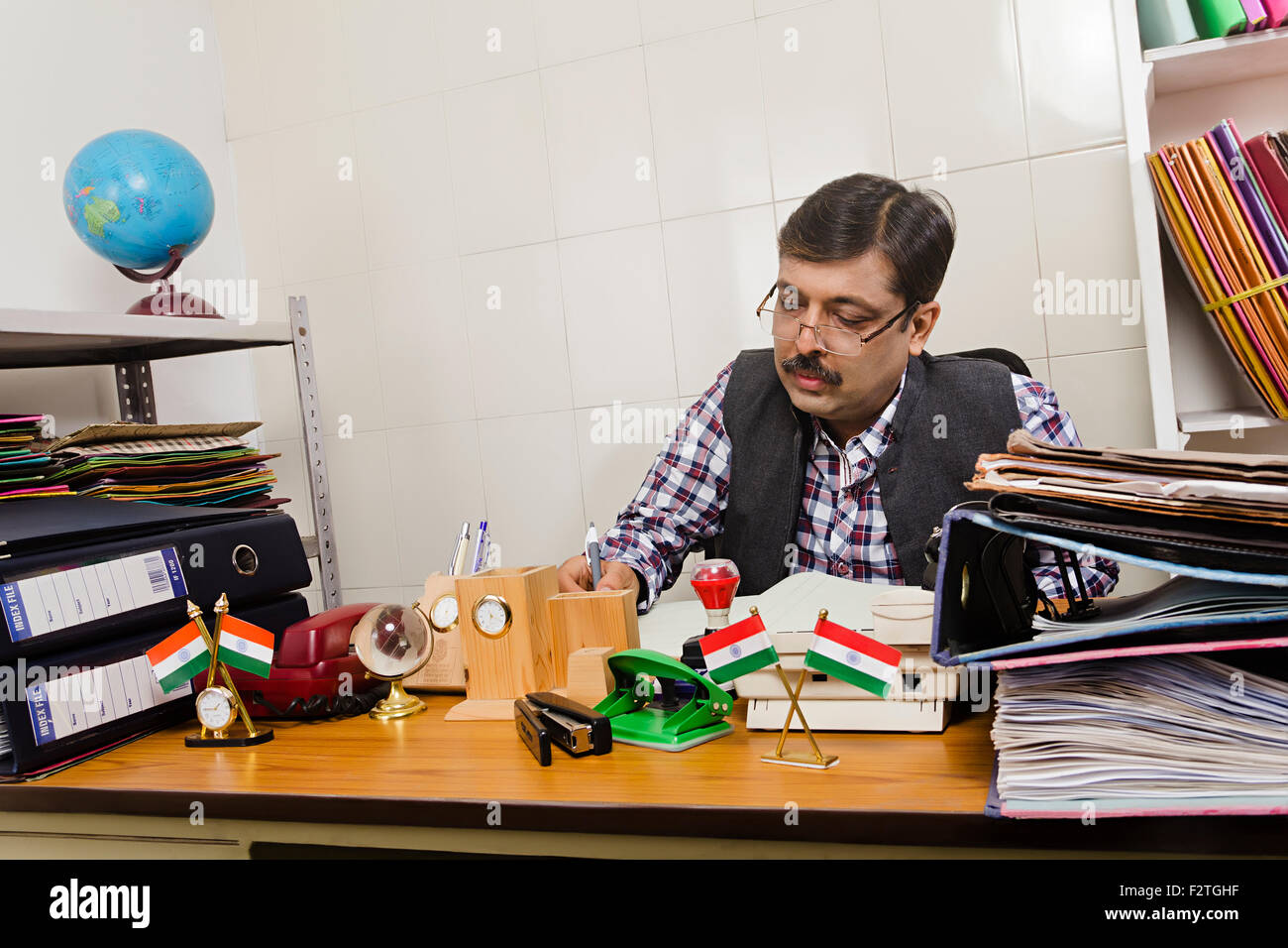 1 indian Man Government Employee office sitting working Stock Photo - Alamy