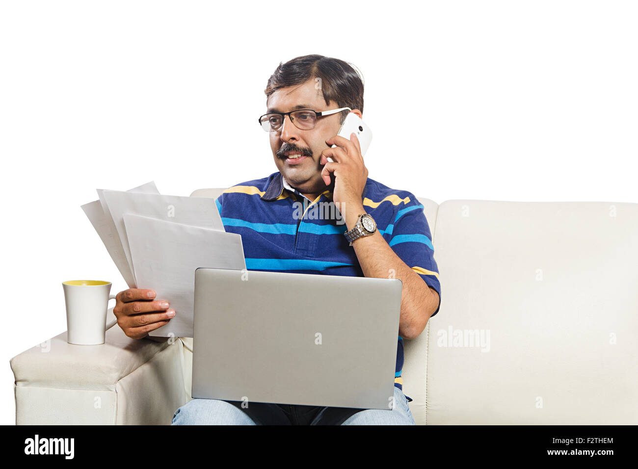 1 indian Adult Man Laptop and Mobile Phone talking Multi Tasking Stock ...