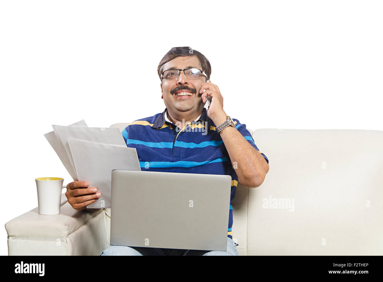 1 indian Adult Man Laptop and Mobile Phone talking Multi Tasking Stock Photo - Alamy