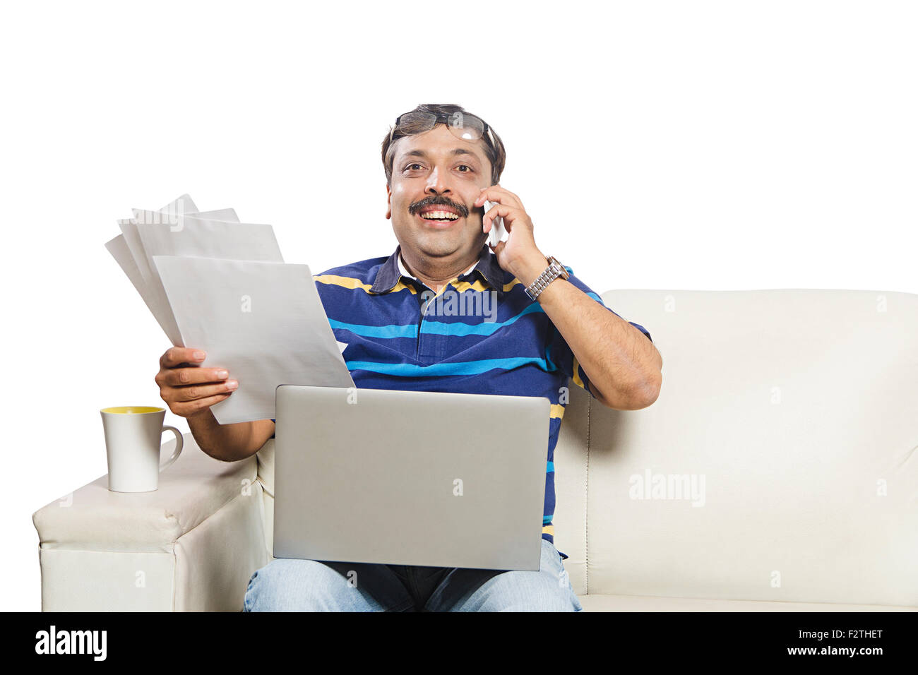 1 indian Adult Man Laptop and Mobile Phone talking Multi Tasking Stock ...