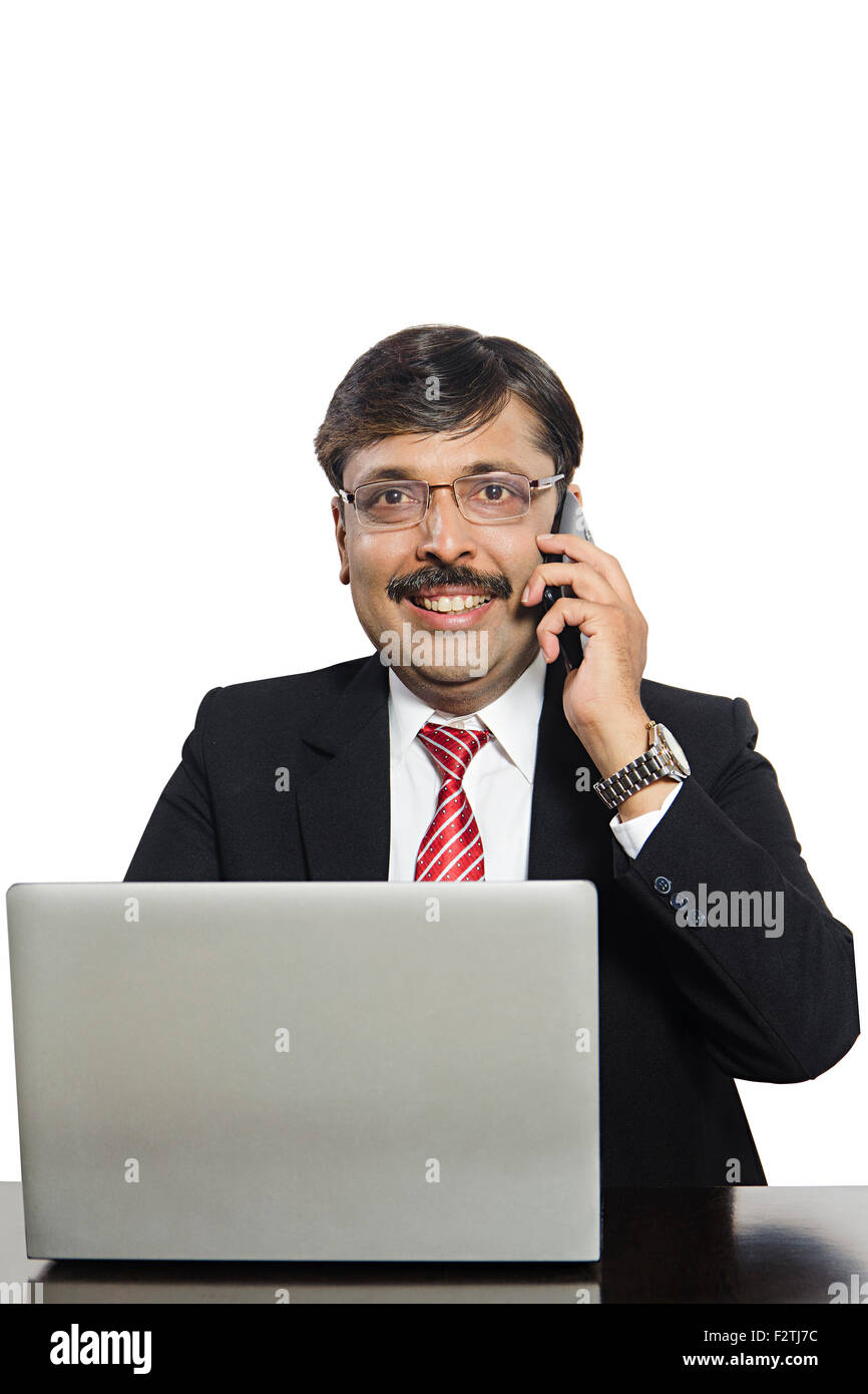 1 indian Business Man Laptop and Mobile Phone talking Multi Tasking ...