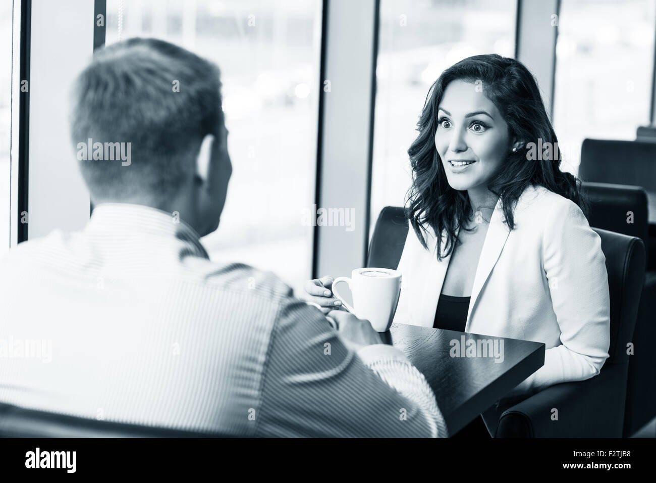 Couple enjoying coffee Stock Photo - Alamy