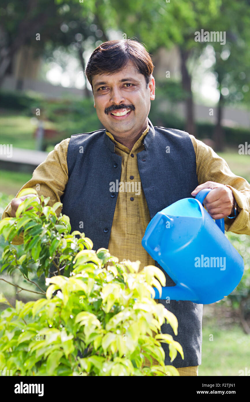 Person watering plant hi-res stock photography and images - Alamy